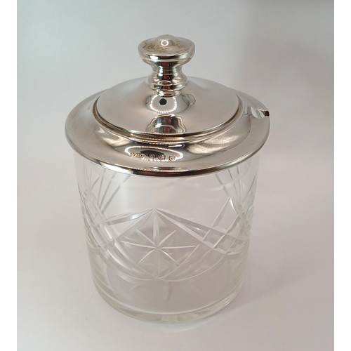 A 1927 silver jar and lid