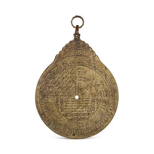 AN ENGRAVED BRASS QAJAR ASTROLABE, PERSIA, 19TH CENTURY A finely ...