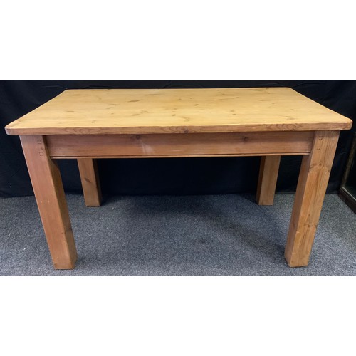 A pine rectangular kitchen table, 76cm high, 130cm wide, 75cm deep