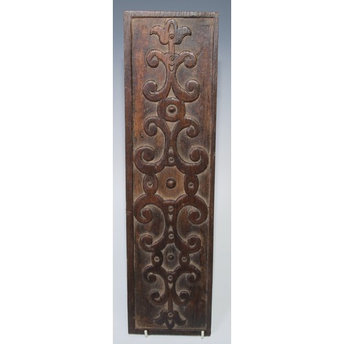 A 16th century oak Romayne type panel, carved in relief with a portrait ...
