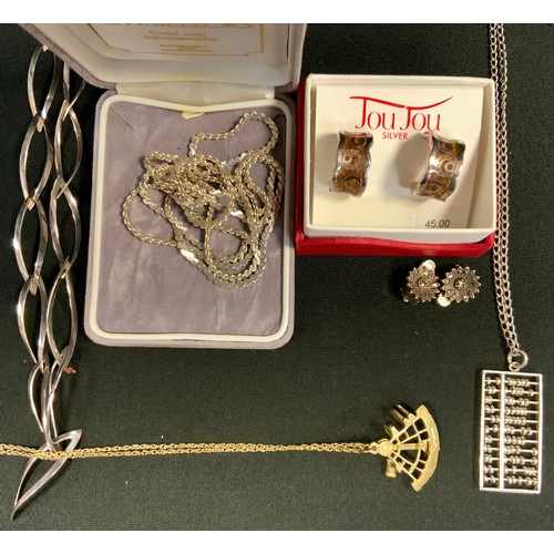 A silver gilt sextant pendant necklace; another Abacus ; Jou Jou silver ...