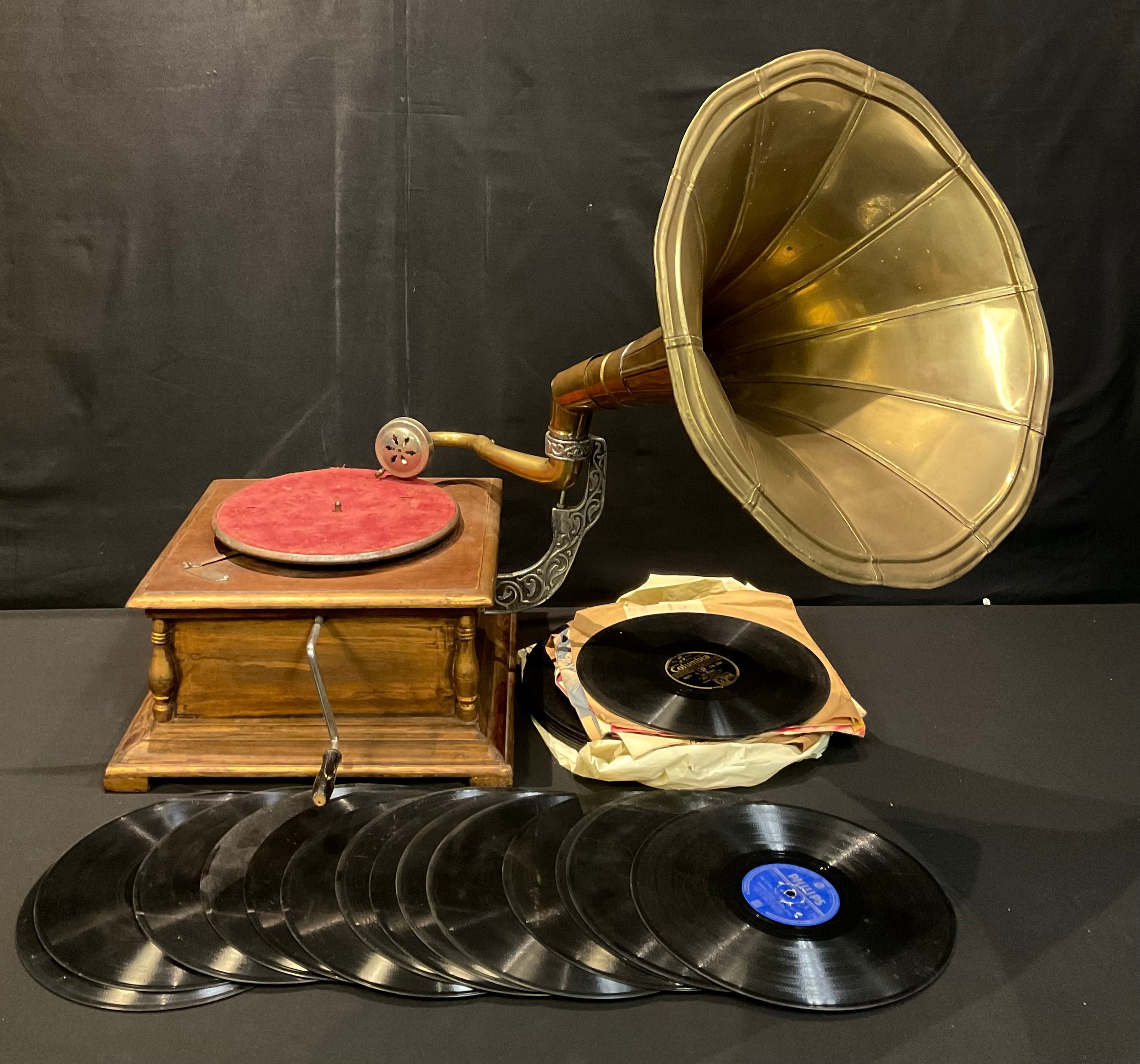 An Edwardian style wind up table top gramophone with brass horn; a ...