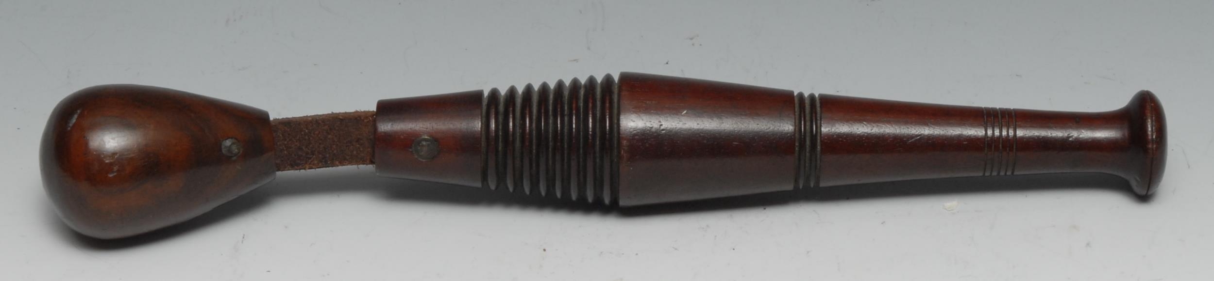 A Victorian lignum vitae life preserver or cosh, urnular head attached ...