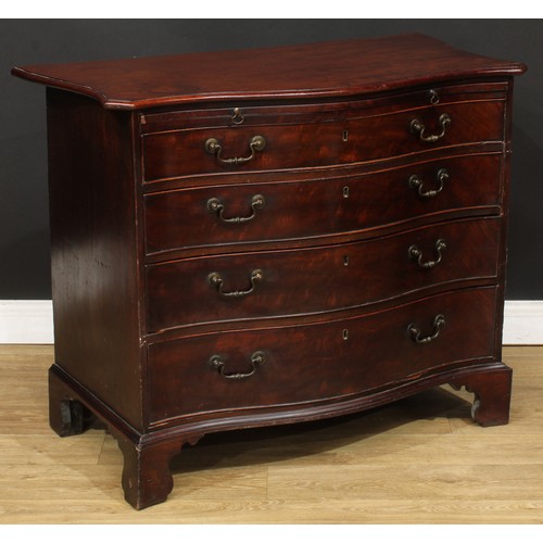 A George III mahogany serpentine bachelor’s chest, oversailing top ...
