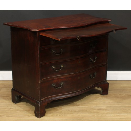 A George III mahogany serpentine bachelor’s chest, oversailing top ...