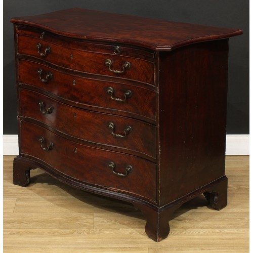 A George III mahogany serpentine bachelor’s chest, oversailing top ...