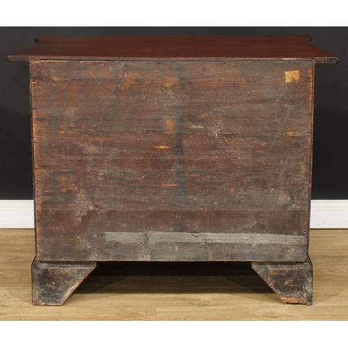A George III mahogany serpentine bachelor’s chest, oversailing top ...