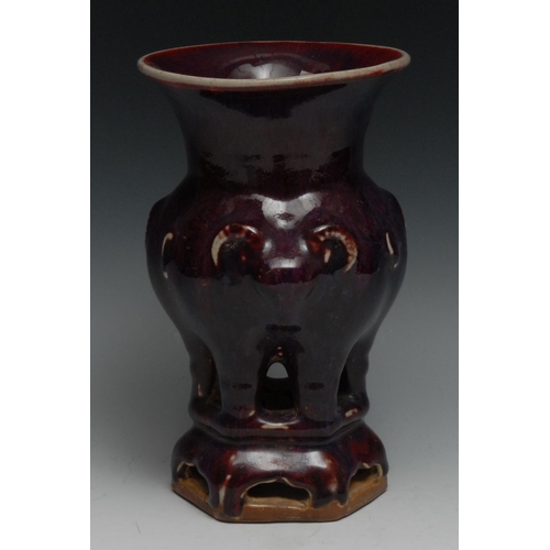 A Chinese high fired monochrome vase, glazed in tones of mottled plum ...
