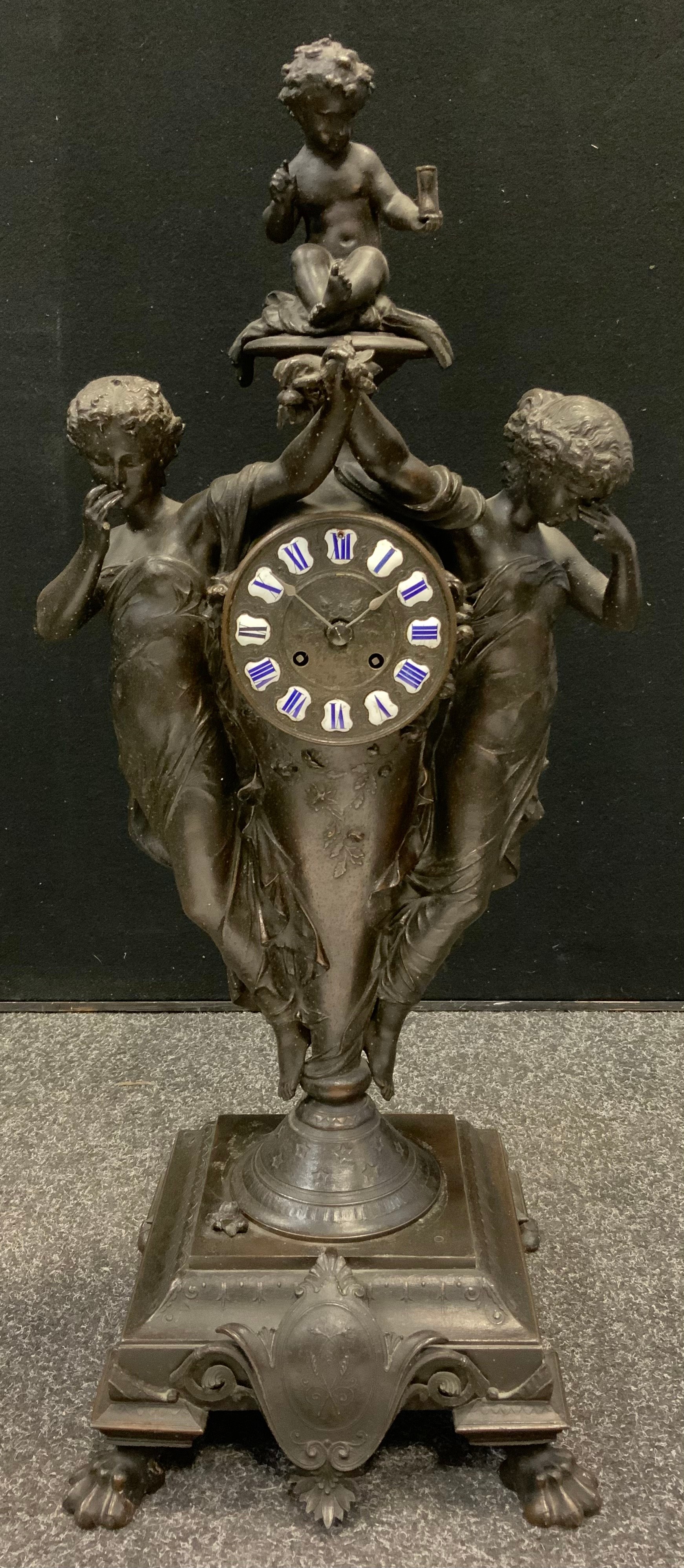A French figural spelter clock, the 11.5cm dial with blue enamelled ...
