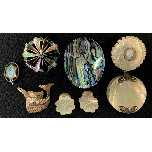 An enamelled silver oval brooch; mother of pearl mounted magnifying ...