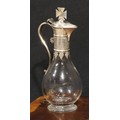A Victorian Gothic Revival silver mounted clear glass ovoid Communion ...