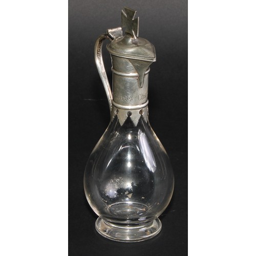 A Victorian Gothic Revival silver mounted clear glass ovoid Communion ...
