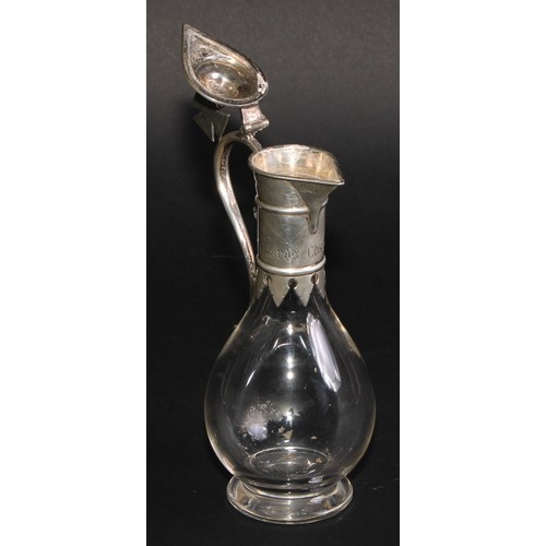 A Victorian Gothic Revival silver mounted clear glass ovoid Communion ...