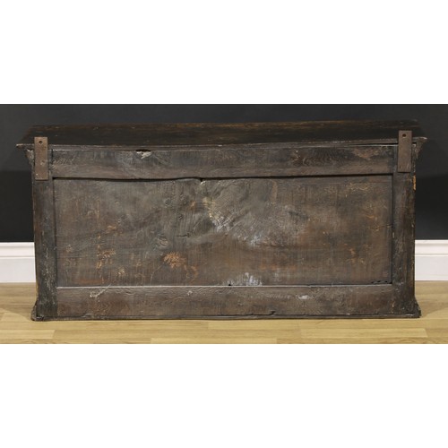 A late 17th/early 18th century oak wall-hanging provision cupboard, the ...