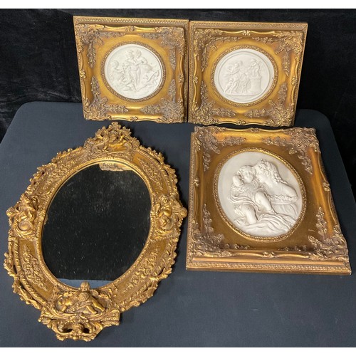 A reconstituted marble oval plaque in relief, after the antique, ornate ...