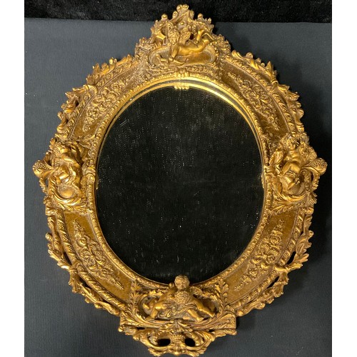 A reconstituted marble oval plaque in relief, after the antique, ornate ...
