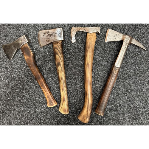 A collection of four hand Axes. Three with leather blade guards. One ...