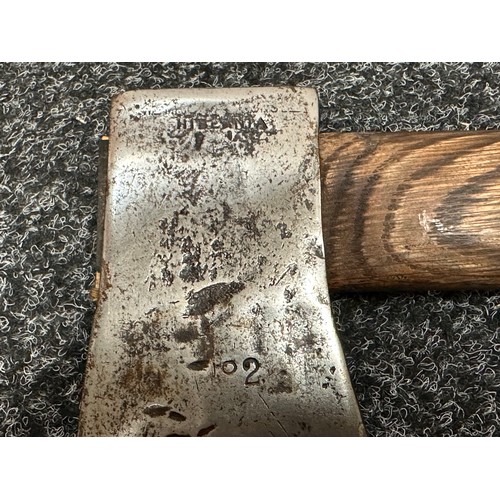 A collection of four hand Axes. Three with leather blade guards. One ...