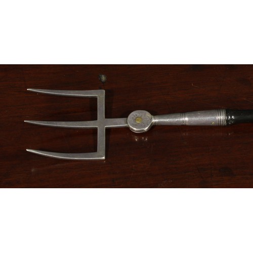 A George III silver toasting fork, the three-prong terminal adjustable ...