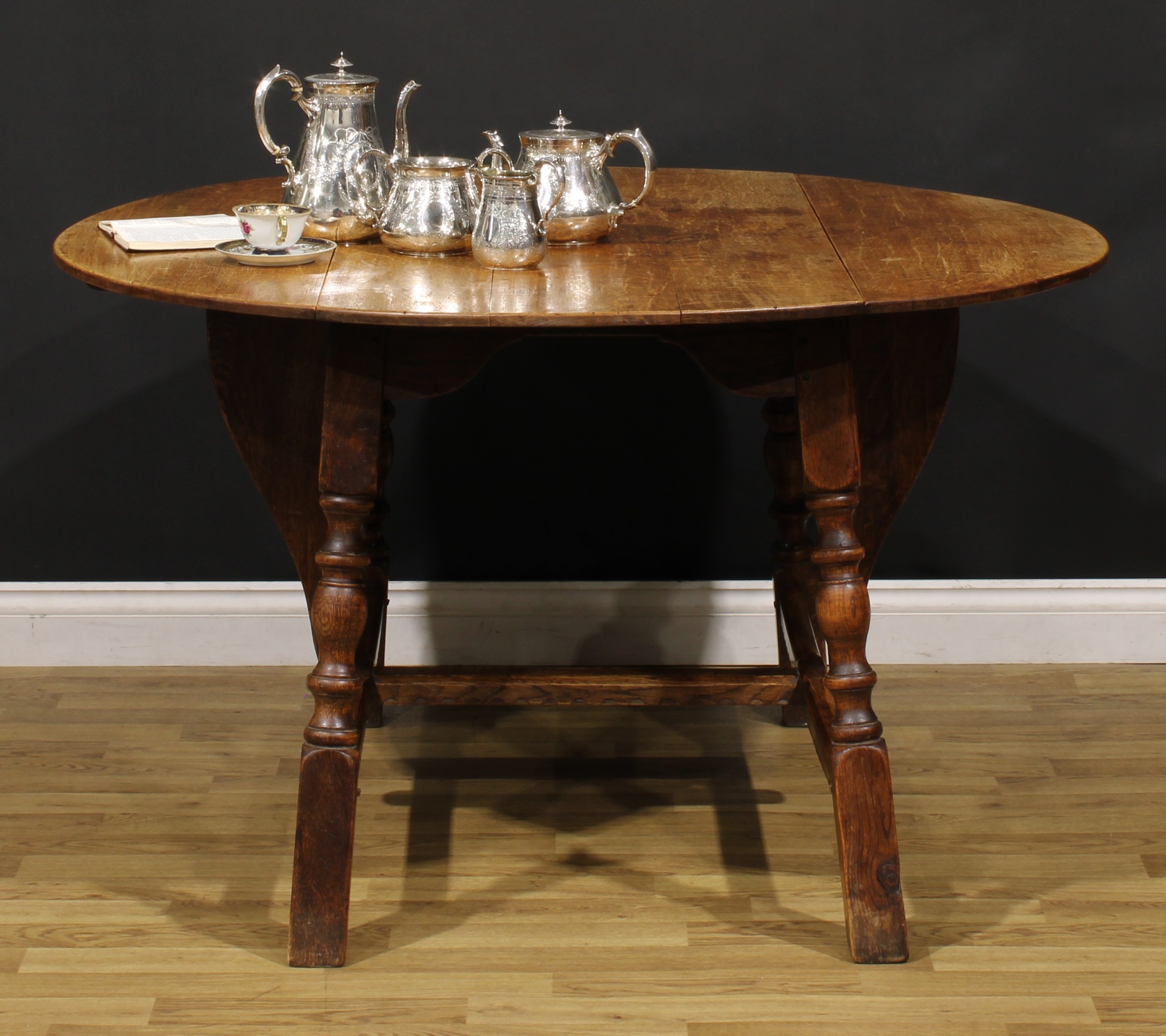 An oak dropleaf dining table, by Rupert/Nigel Griffiths Monastic ...