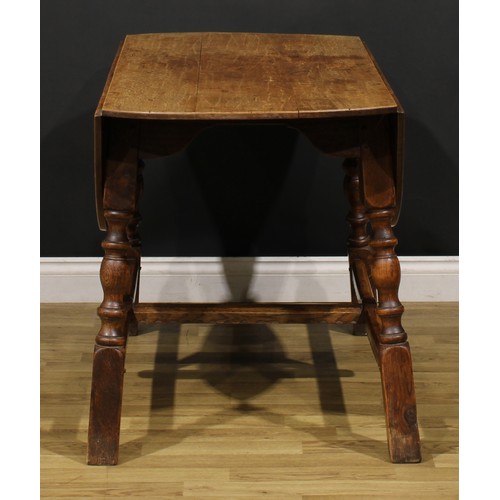 An oak dropleaf dining table, by Rupert/Nigel Griffiths Monastic ...