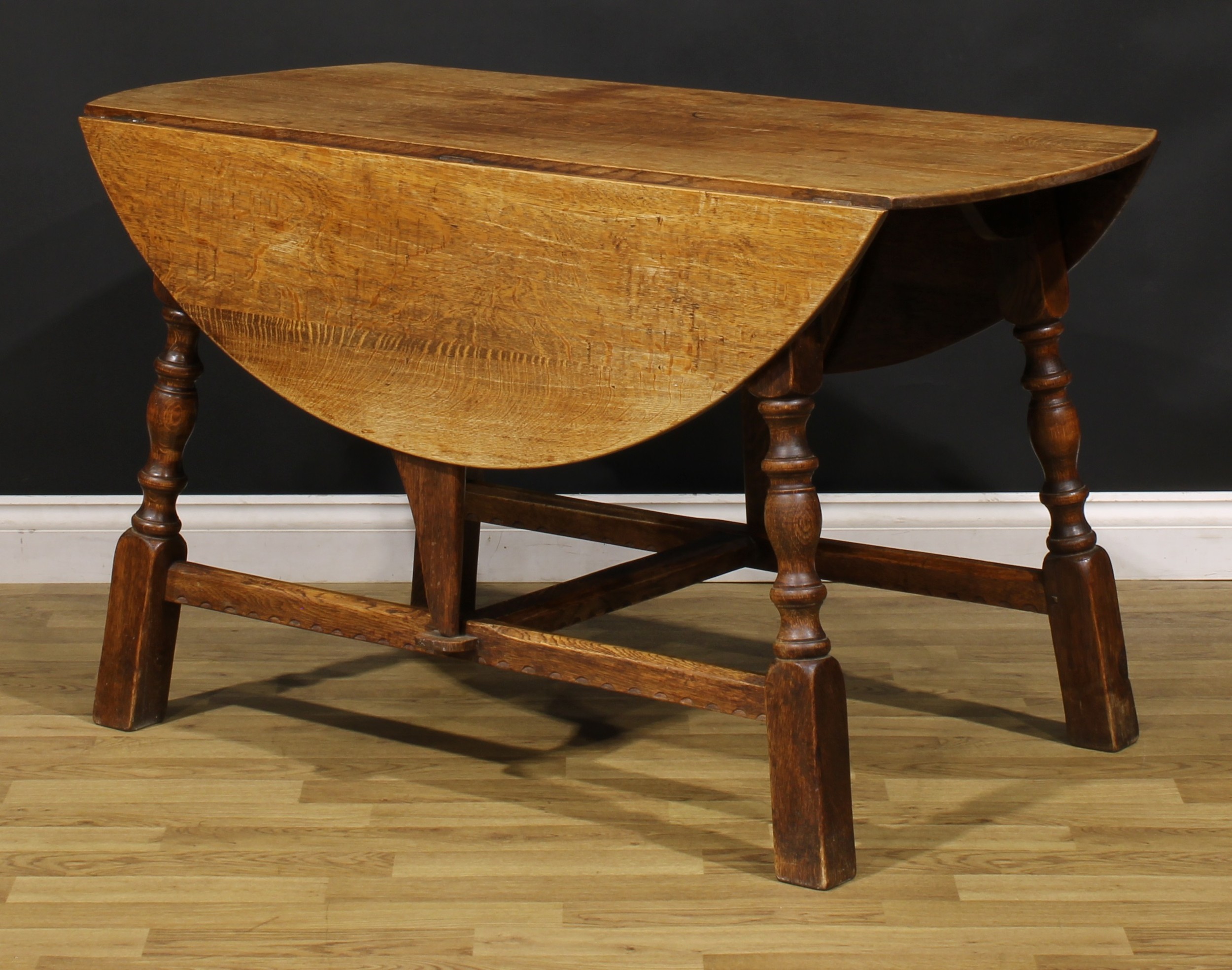 An oak dropleaf dining table, by Rupert/Nigel Griffiths Monastic ...