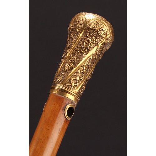 An 18th century gold mounted walking stick, spirally fluted pommel ...