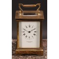 A lacquered brass carriage timepiece, 7cm enamel clock dial inscribed ...