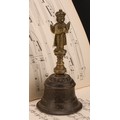 An Indian bronze and copper alloy hand bell, the haft cast as a Hanuman ...