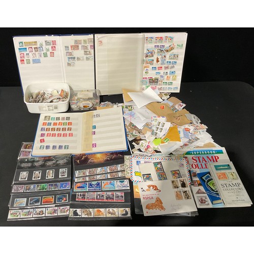 Stamps - a quantity of stamps and books, etc. in three stock books ...