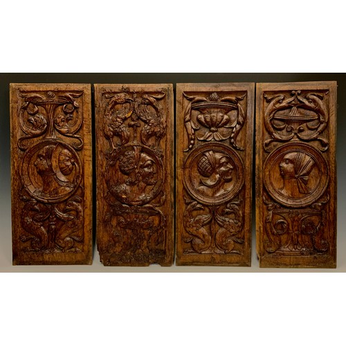 A set of four 16th century Romayne carved oak Portrait panels, each ...