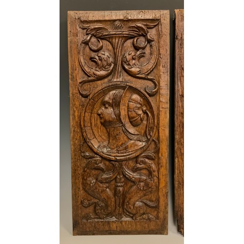 A set of four 16th century Romayne carved oak Portrait panels, each ...