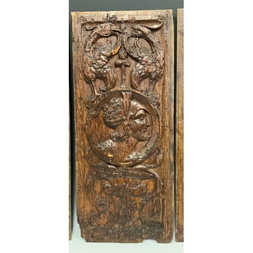 A set of four 16th century Romayne carved oak Portrait panels, each ...