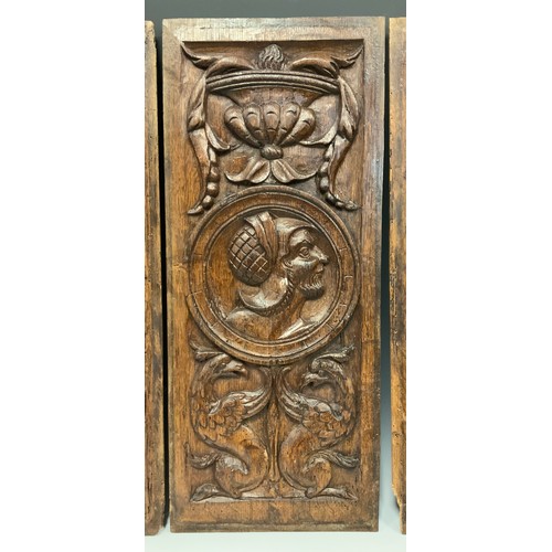 A set of four 16th century Romayne carved oak Portrait panels, each ...