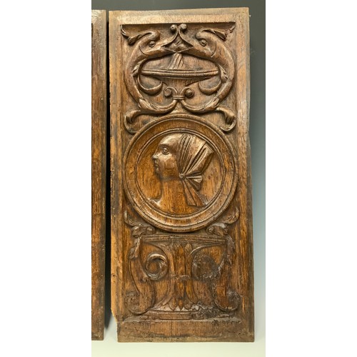 A set of four 16th century Romayne carved oak Portrait panels, each ...