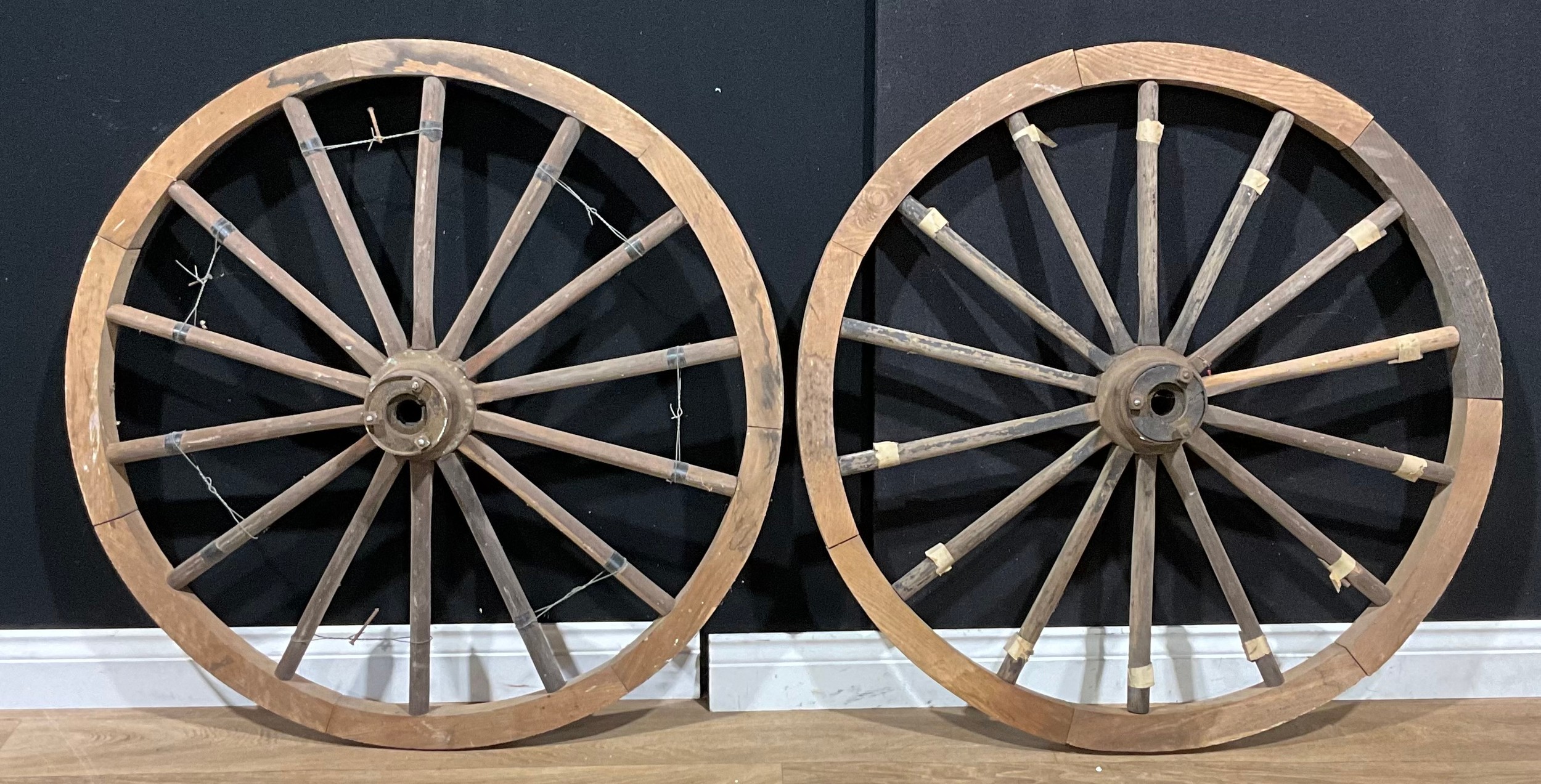A pair of vintage cart wheels or wagon wheels, 100cm diameter