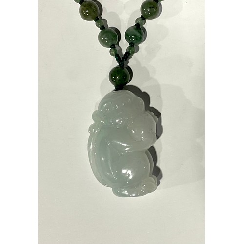 A Chinese carved jade monkey