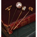 Stick Pins - a 19th century 15ct gold wishbone stick pin, set with a ...