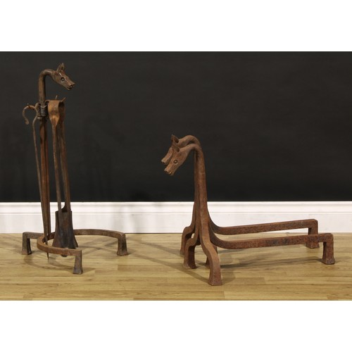 An Arts & Crafts wrought iron zoomorphic fireside hearth suite ...