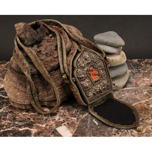 A Tibetan silver coloured metal and copper Buddhist gau box, typically ...