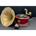 A HMV hand wound gramophone, circular wooden case, brass trumpet ...