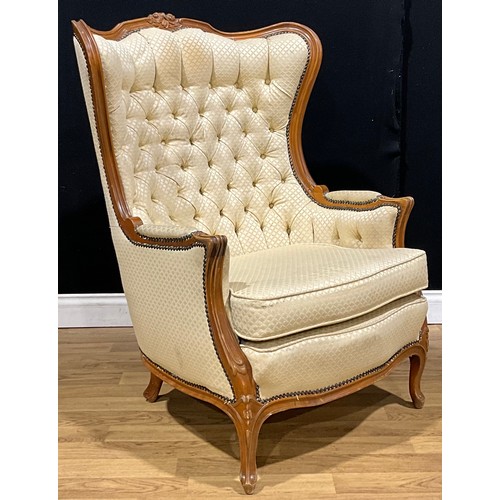 A Louis XV Revival salon chair, stuffed-over upholstery, button back ...