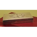 A Japanese silver rectangular cigar box, the cover chased in the ...