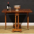 A Victorian satinwood Sutherland table, rounded rectangular top with ...