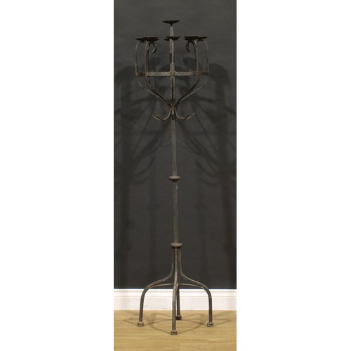 A wrought iron floor-standing nine light pricket candle stand, 163cm high