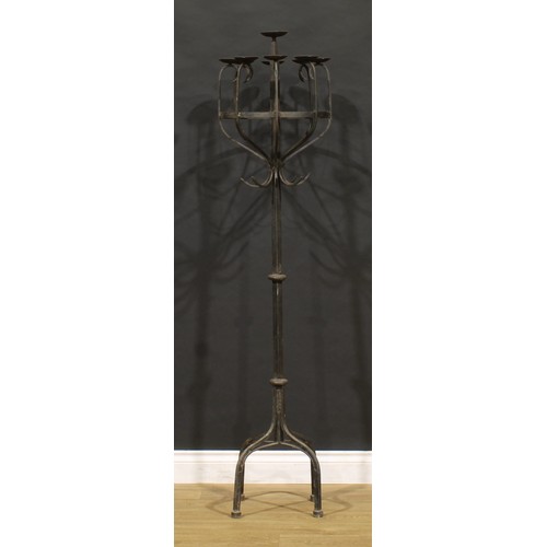 A wrought iron floor-standing nine light pricket candle stand, 163cm high