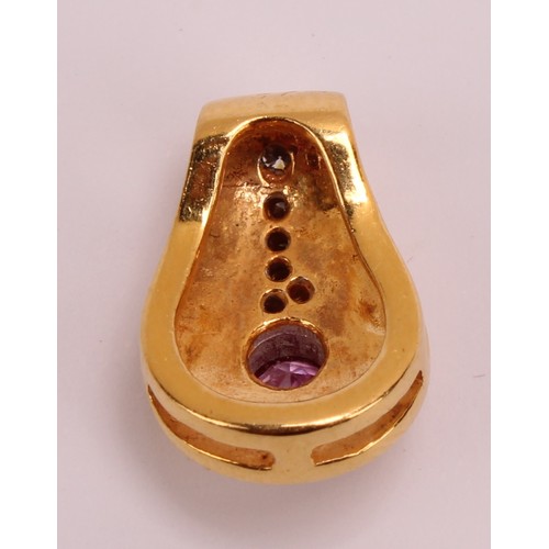 A tested 18ct gold pink sapphire and diamond pendant, set with a round ...