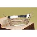 Paul Storr - a George III silver boat shaped bread basket, reeded rim ...