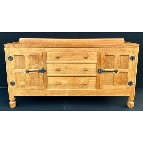 A Robert Thompson ‘Mouseman’ oak sideboard, the quarter galleried, and ...