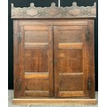 A 19th century oak cupboard, carved railing above moulded cornice to ...